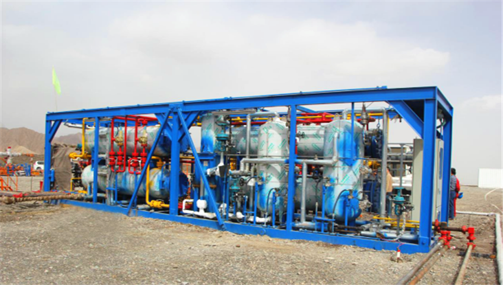 How is the natural gas separated from the well fluid